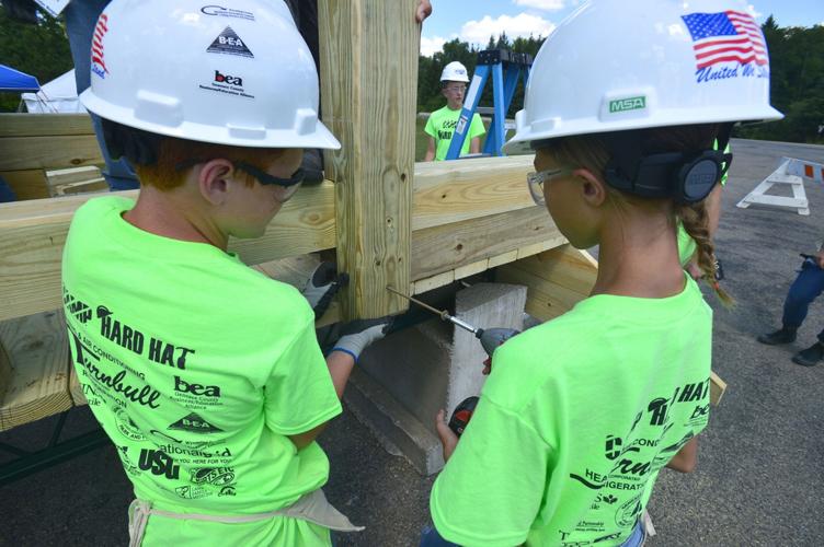 Building a bridge, bonds Students construct bridge over Wetland Berm ...