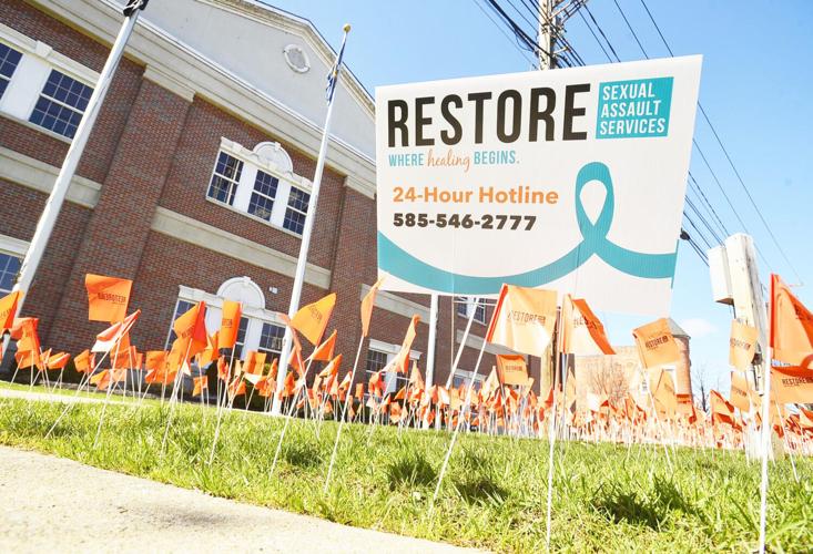 RESTORE plants flags for Sexual Assault Awareness Month | Top Story | thedailynewsonline.com