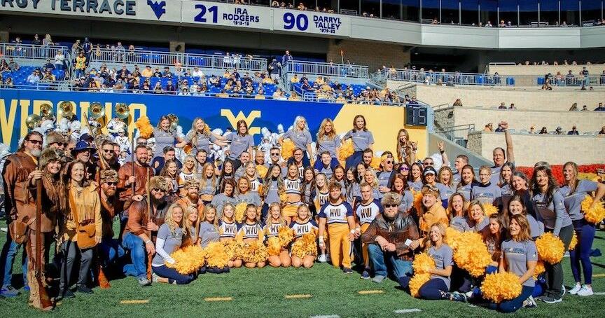 Alumni cheerleaders return to the field for Homecoming celebration ...