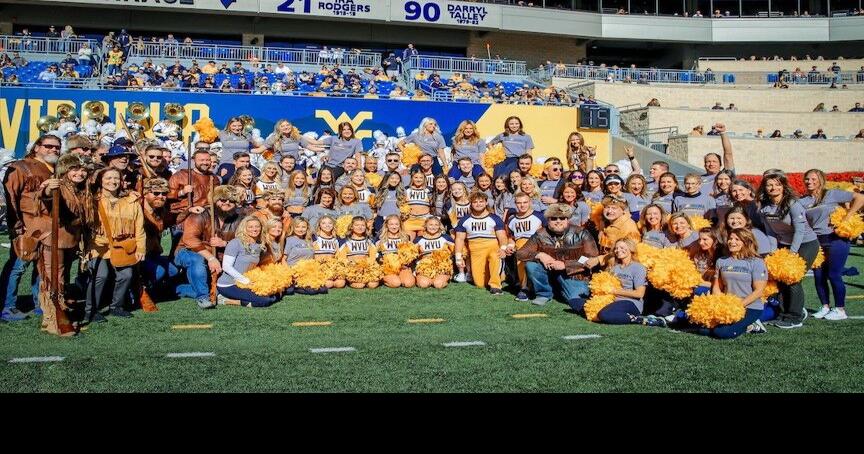 Alumni cheerleaders return to the field for Homecoming celebration ...