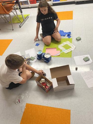 East Forest fifth graders conduct hands-on science experiments ...