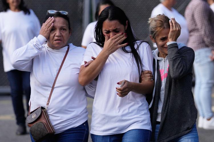 Photos show relatives waiting outside prisons as Venezuela frees a ...