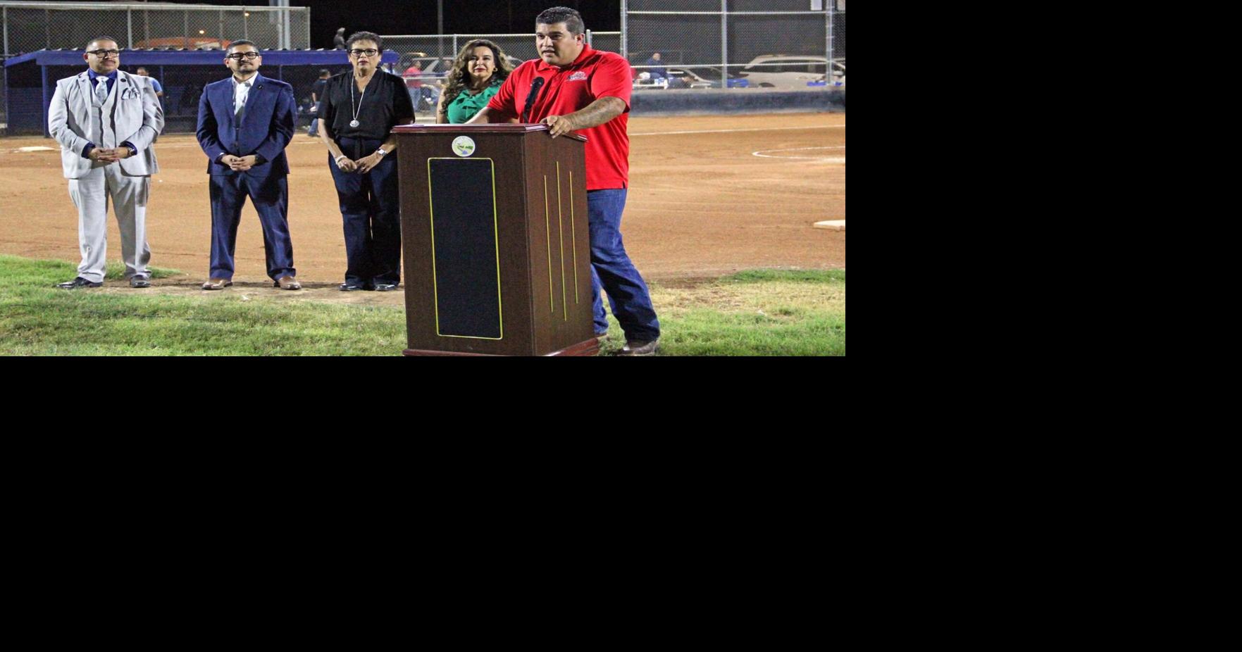 Softball players and dignitaries watch the Debbie Pittman Park light up ...