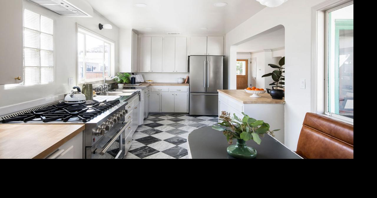 A kitchen with a checkered floor and white cabinets | Sponsored ...