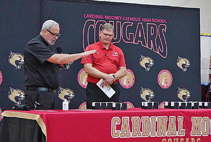Mooney basketball team members receive their championship rings, give ...