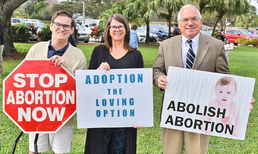 Advocates stand among flags honoring the unborn | Palm Beach ...