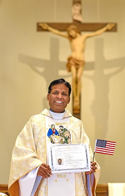 Father Britto becomes citizen | Orlando | thefloridacatholic.org