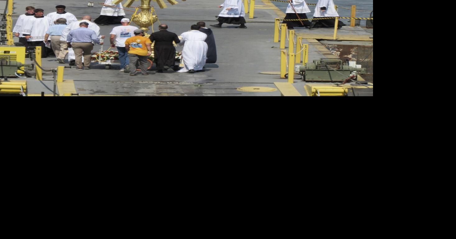 Hundreds line river banks for procession of boats ferrying Eucharist ...