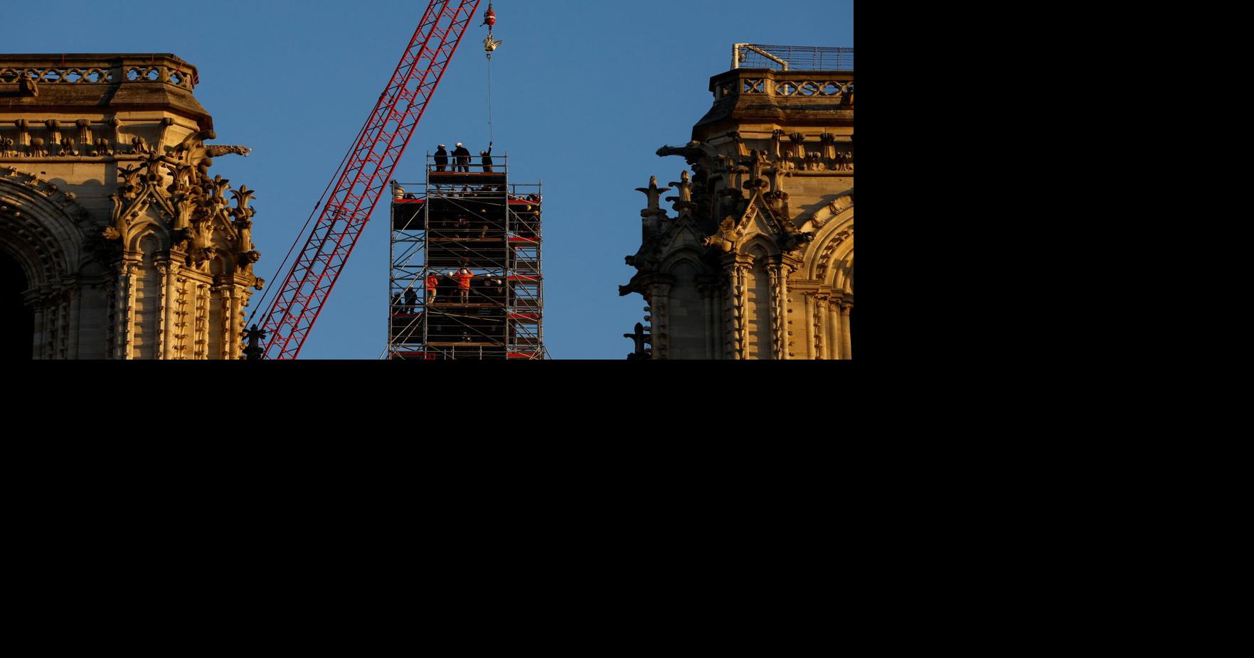 An iconic cockerel is once again watching over Notre Dame in Paris on ...