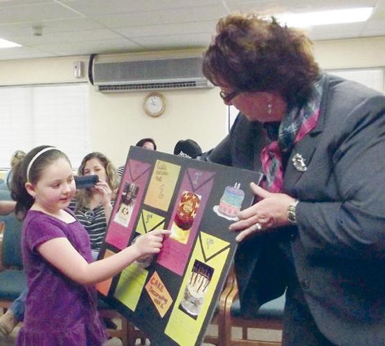 Commissioners enjoyed 4-H presentations on hunting articles and cake ...