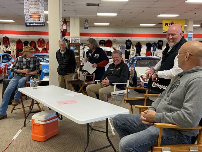 Race fans talk moonshine and eat hot dogs