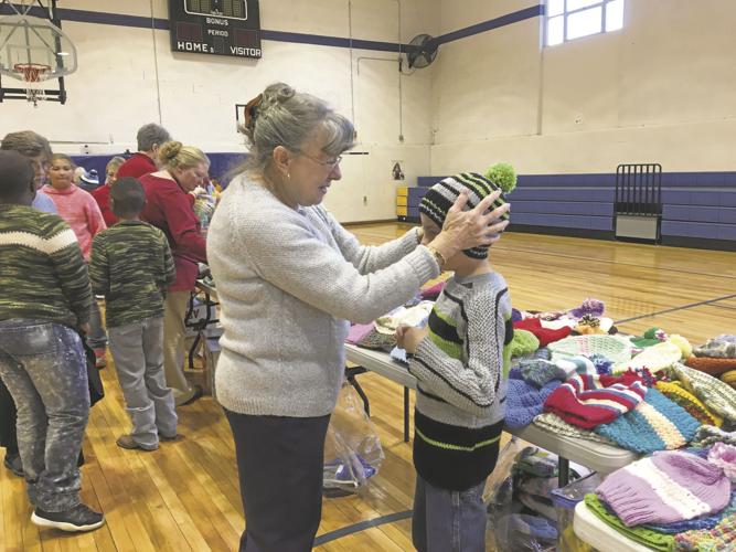 Lee M. Waid students receive free winter sweaters