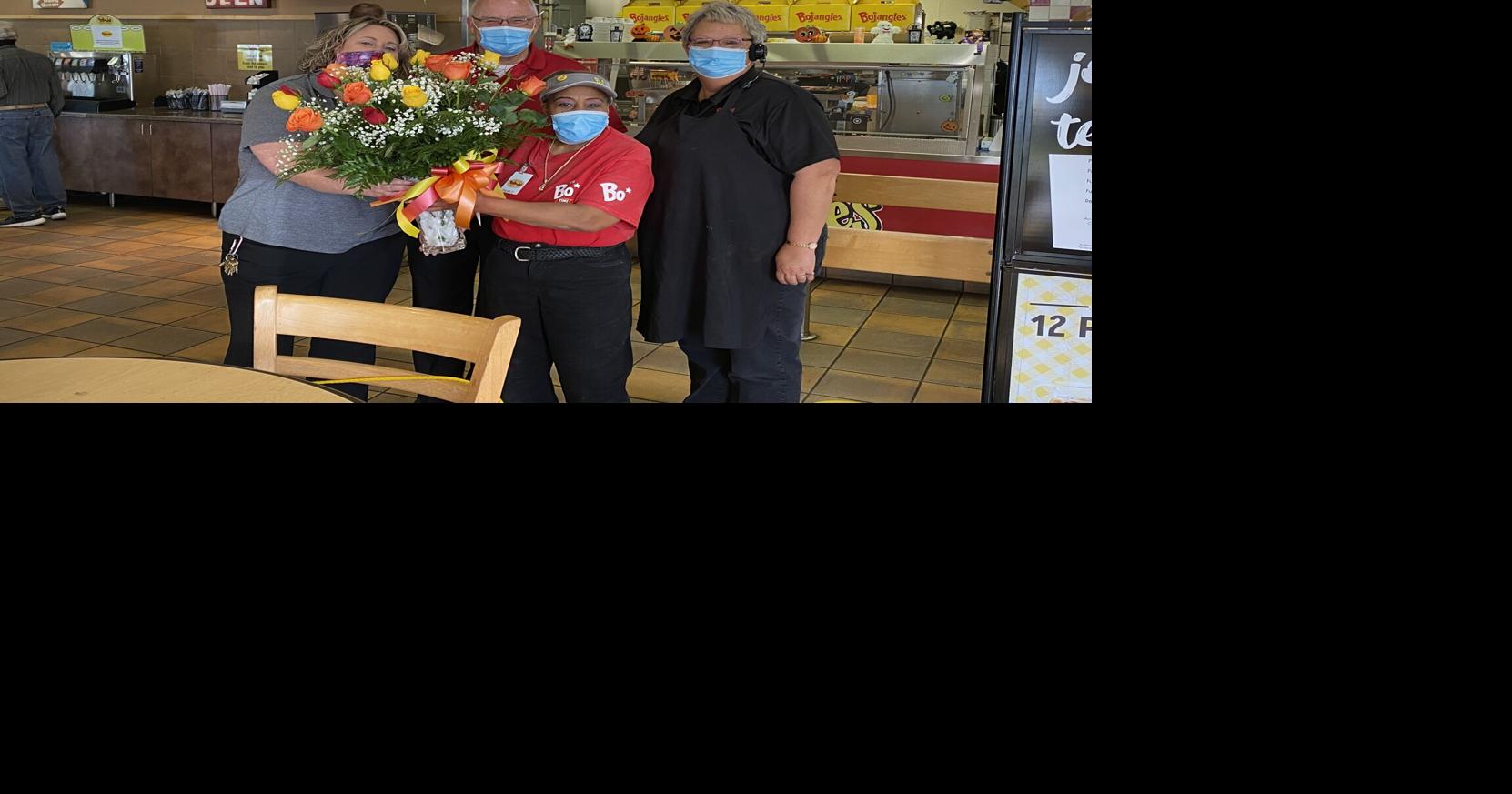 Bojangles employee hangs up her apron