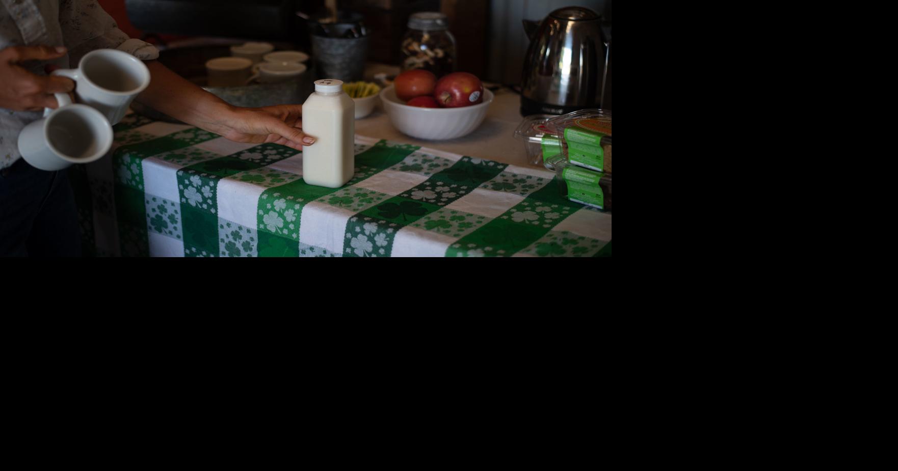 Valeri Crenshaw sets a bottle of camel milk down on the counter after ...