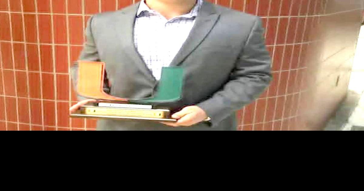 Michael Parrott holds his Scout Team Player of the Year award ...