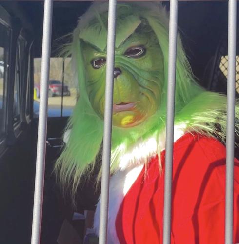 Caught green handed: Grinch cuffed and arrested at Bethel Elementary ...