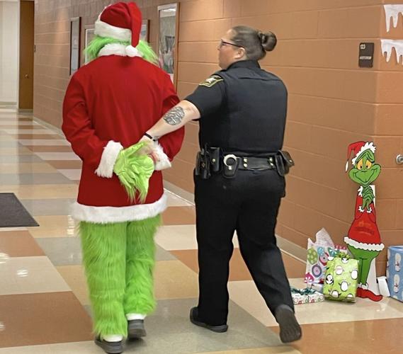 Caught green handed: Grinch cuffed and arrested at Bethel Elementary ...