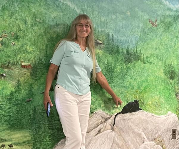 Mural artist paints new scene at elementary school | News ...