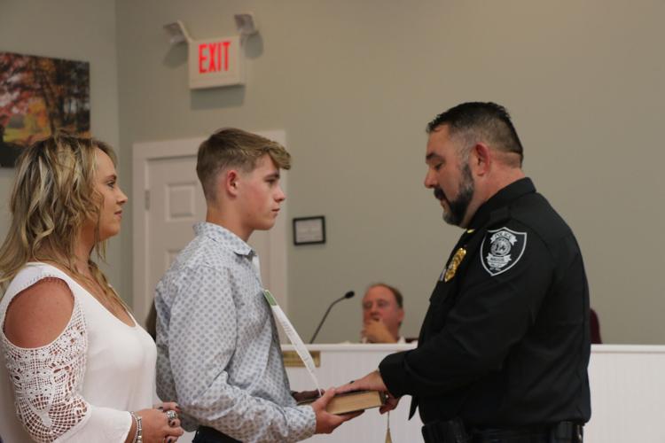 New Maggie police chief honors deceased hero as first official act ...