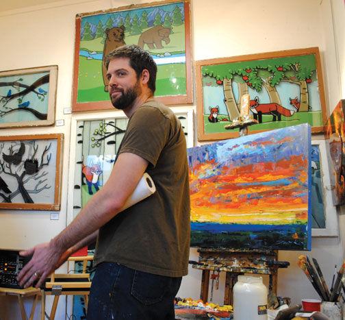 Artist Carl Bork works on his abstract landscape painting | Free ...