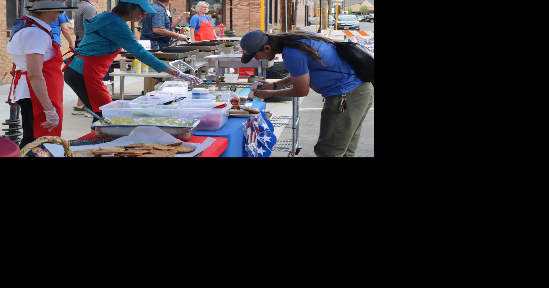 Rees and Runge serve at the Salida Community Center's Community BBQ ...