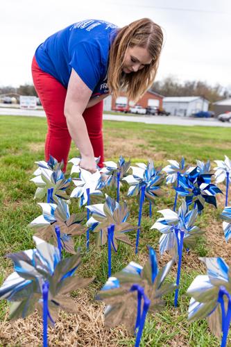 Blue pinwheels spin to spotlight child abuse | Local News ...