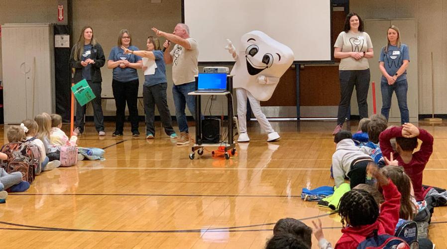 Local dentist celebrates Children's Dental Health Month with students ...
