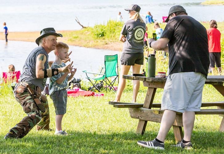Children cast a line for fishing derby | Local News | thenewsenterprise.com