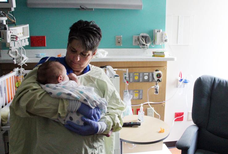 Comfort care: Local couple cuddles babies suffering drug withdrawals ...