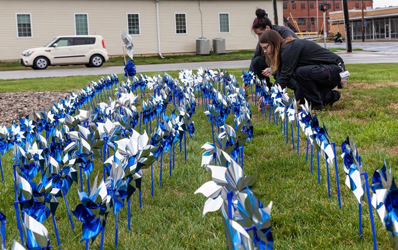 Blue pinwheels spin to spotlight child abuse | Local News ...