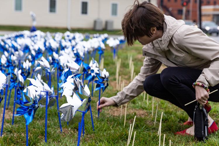 Blue pinwheels spin to spotlight child abuse | Local News ...