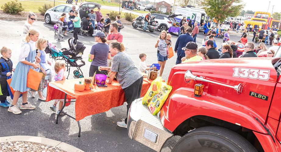 Large crowd enjoys first chance at Halloween candy, fun | Local News ...