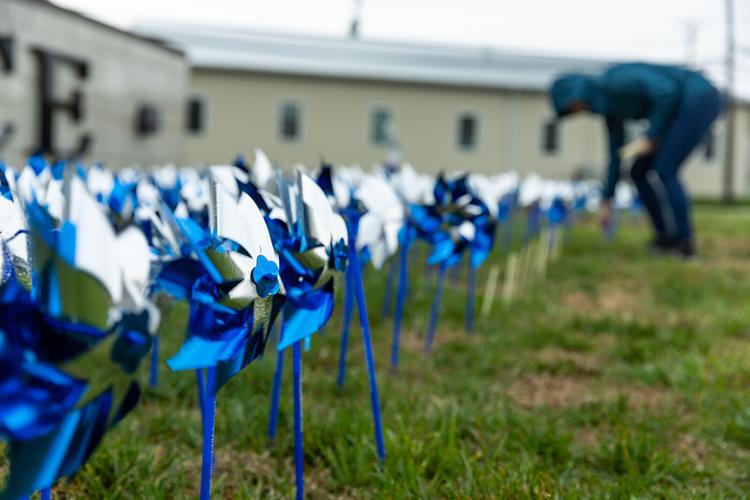 Blue pinwheels spin to spotlight child abuse | Local News ...