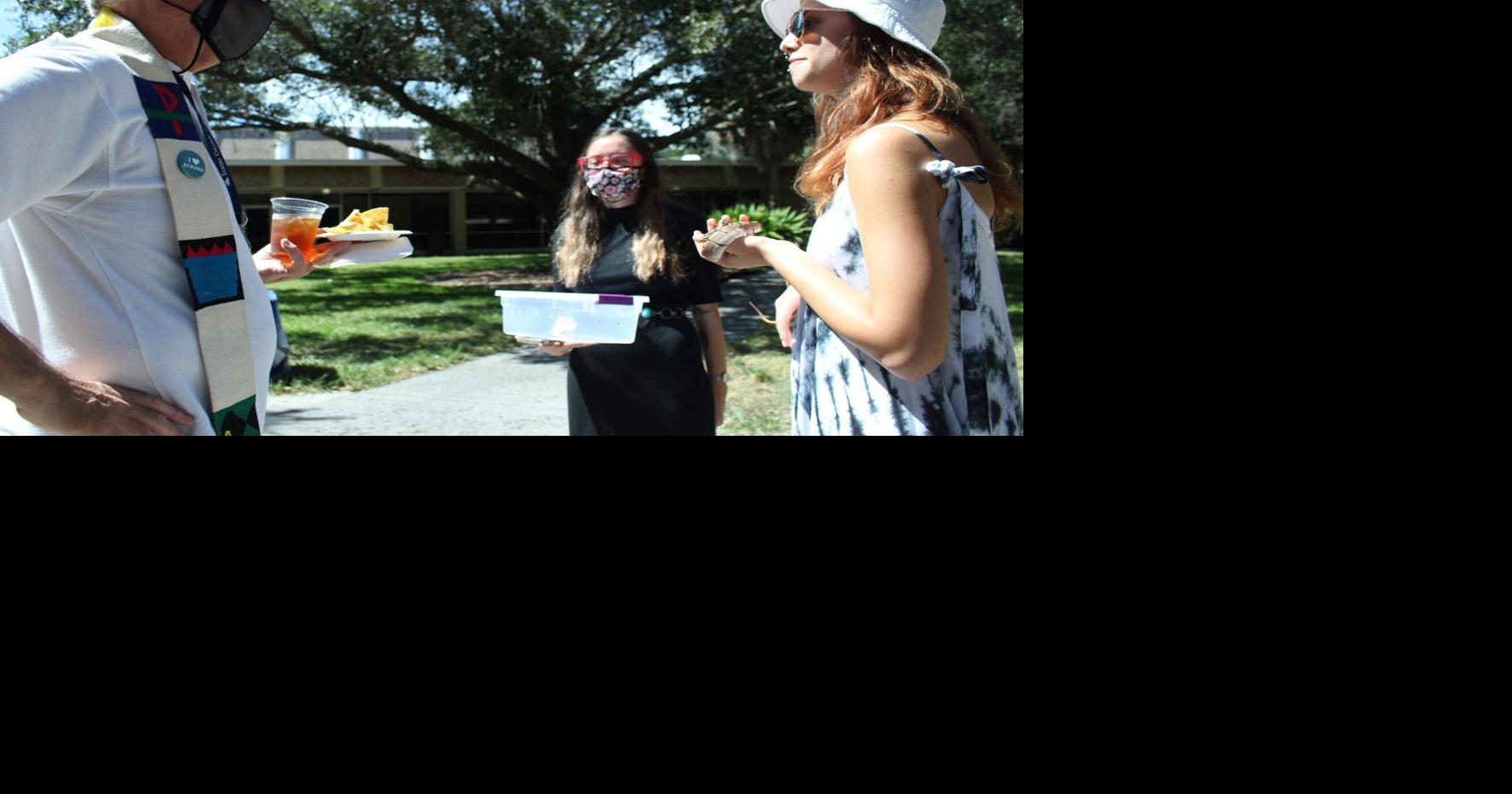 Holy water and a pet food truck in front of Triton’s Pub: Eckerd’s ...
