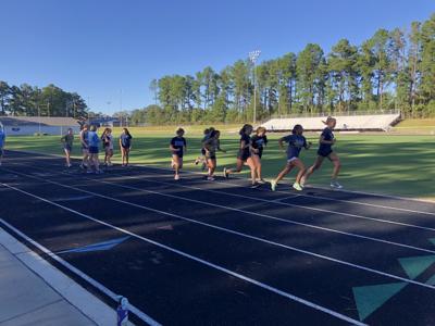 Runners Keeping Their Distance on Cross Country Trails | Sports ...