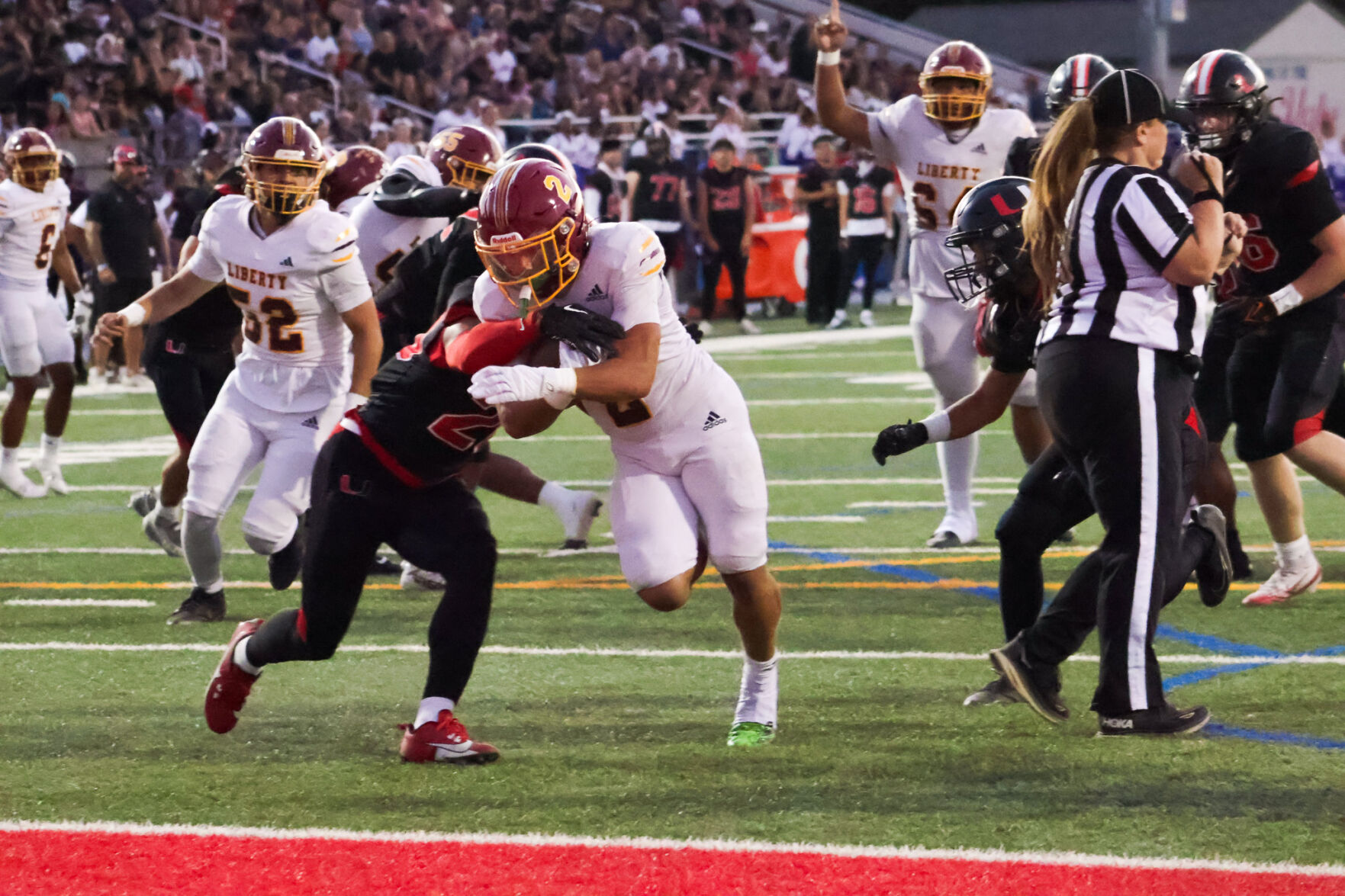 Bell's four touchdowns power Liberty to third-straight win, beating ...