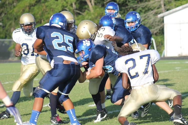 FOOTBALL: Tigers dismantle Confluence Prep, defense holds Titans to ...