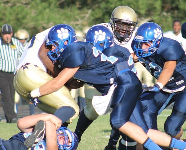 FOOTBALL: Tigers dismantle Confluence Prep, defense holds Titans to ...