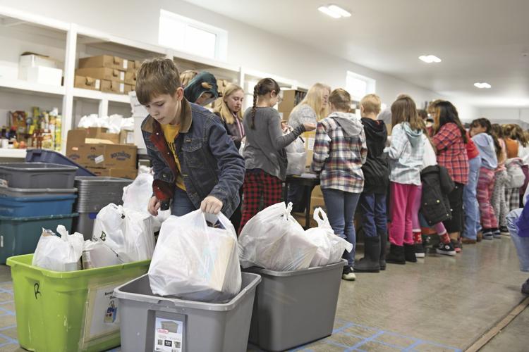 Coffeen Elementary students help with Food Group weekend food bags ...