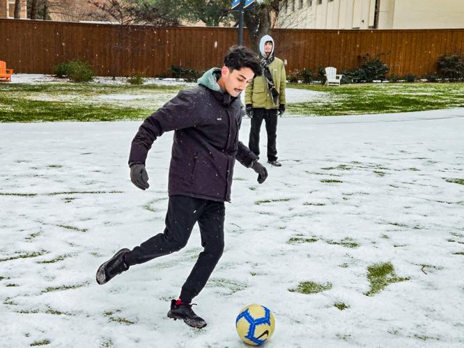Photos: Community embraces snow with sledding, snowmen and soccer ...