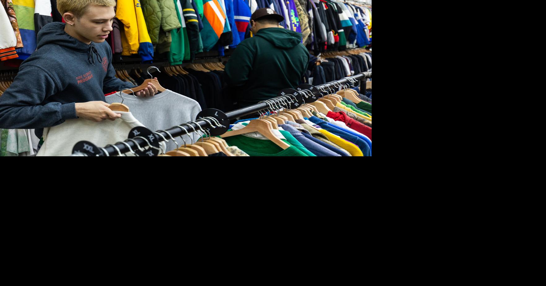 3 downtown Arlington shops sift through the racks of vintage clothing ...