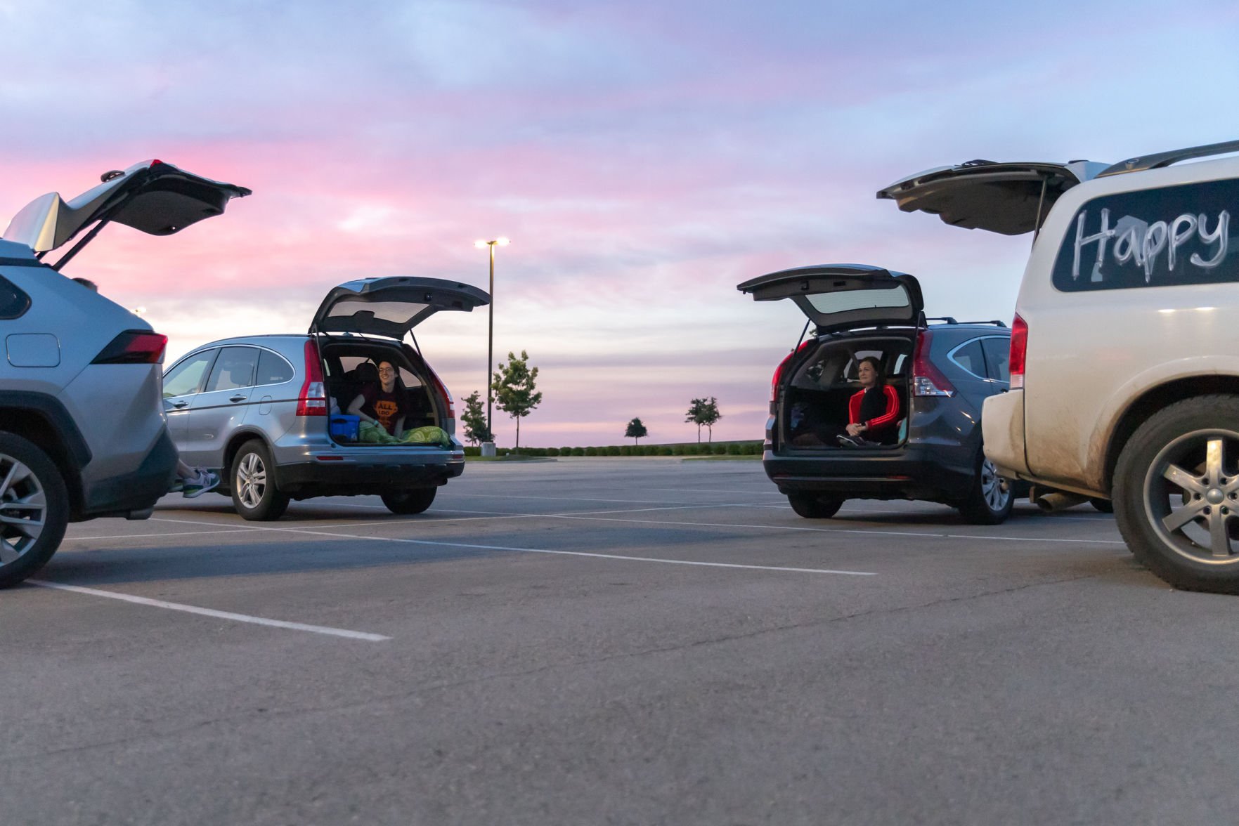 Photos: 4 moms practice social distancing with parking lot parties ...