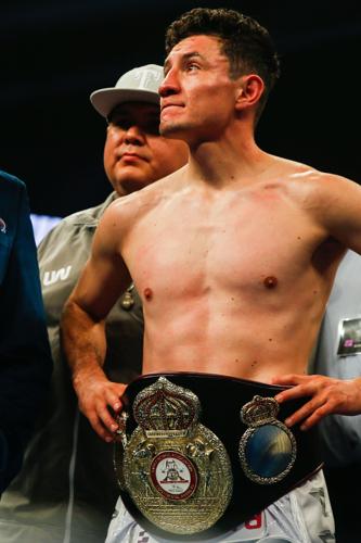 Boxing champion stays undefeated to defend lightweight title at College ...