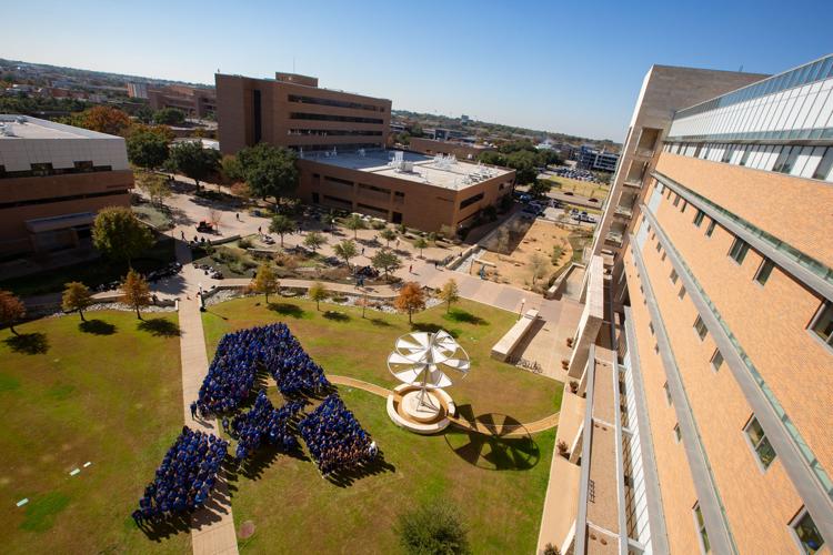 Hundreds of students form the “A” in UTA in an expression of school ...