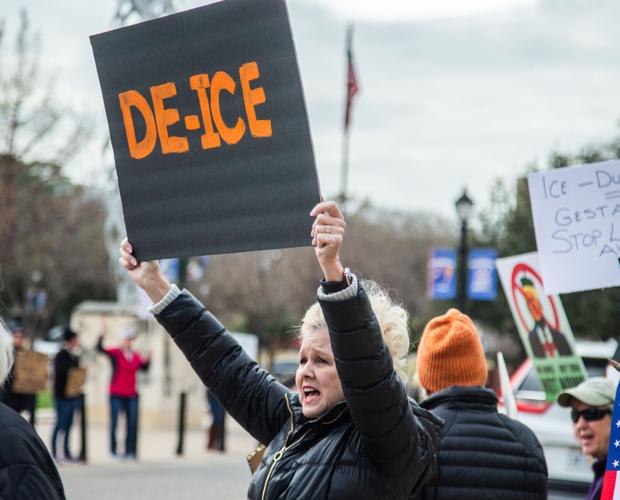 Protesters walk out against Trump administration policies in first year ...