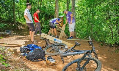Local mountain biking group donates benches for WCU trail system ...