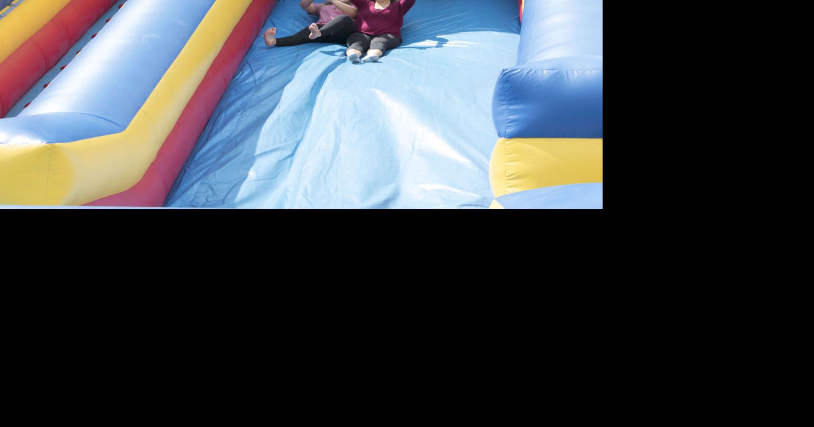 Students jump into 'Paint U' with inflatable obstacle course | News ...