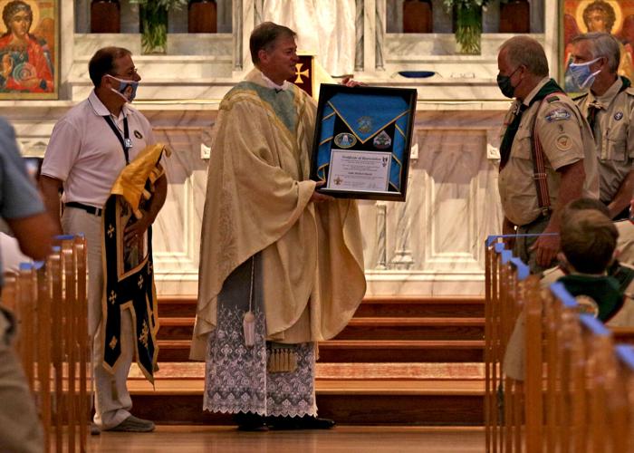 PHOTOS: Maria Assunta Society's 100th annual procession braves the rain ...