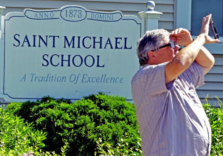 PHOTOS: Rebuilding of St. Michael Church hits milestone with placing of ...