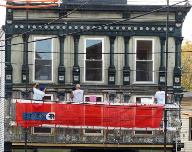 PHOTOS: Scraping the years off a downtown building | News ...